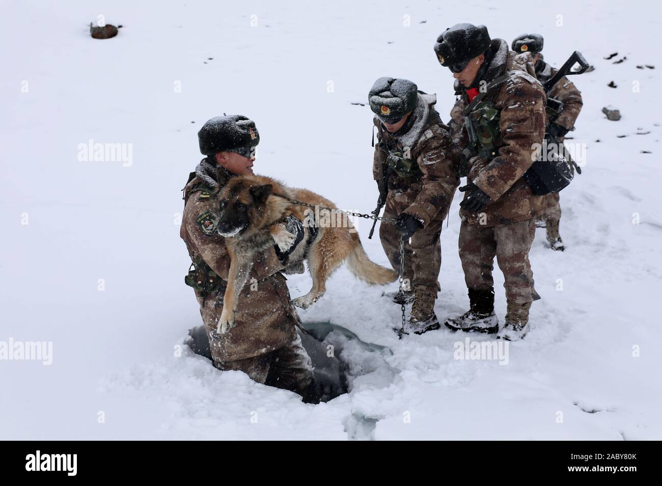 Chinese PLA (People's Liberation Army) soldiers patrol the snow ...
