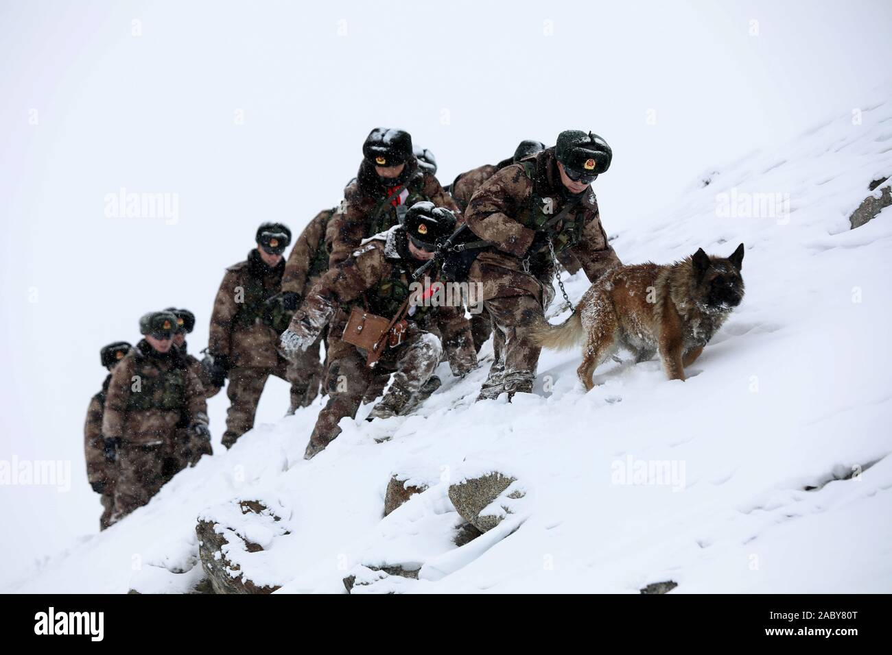 Chinese PLA (People's Liberation Army) soldiers patrol the snow ...