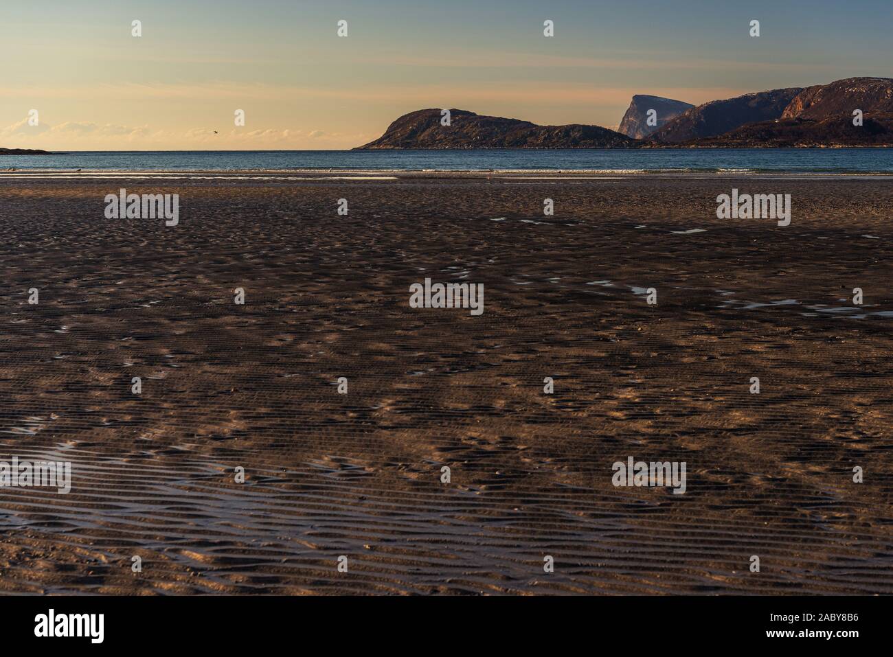 sunset over sandvika beach in Tromso region during a spring afternoon ...