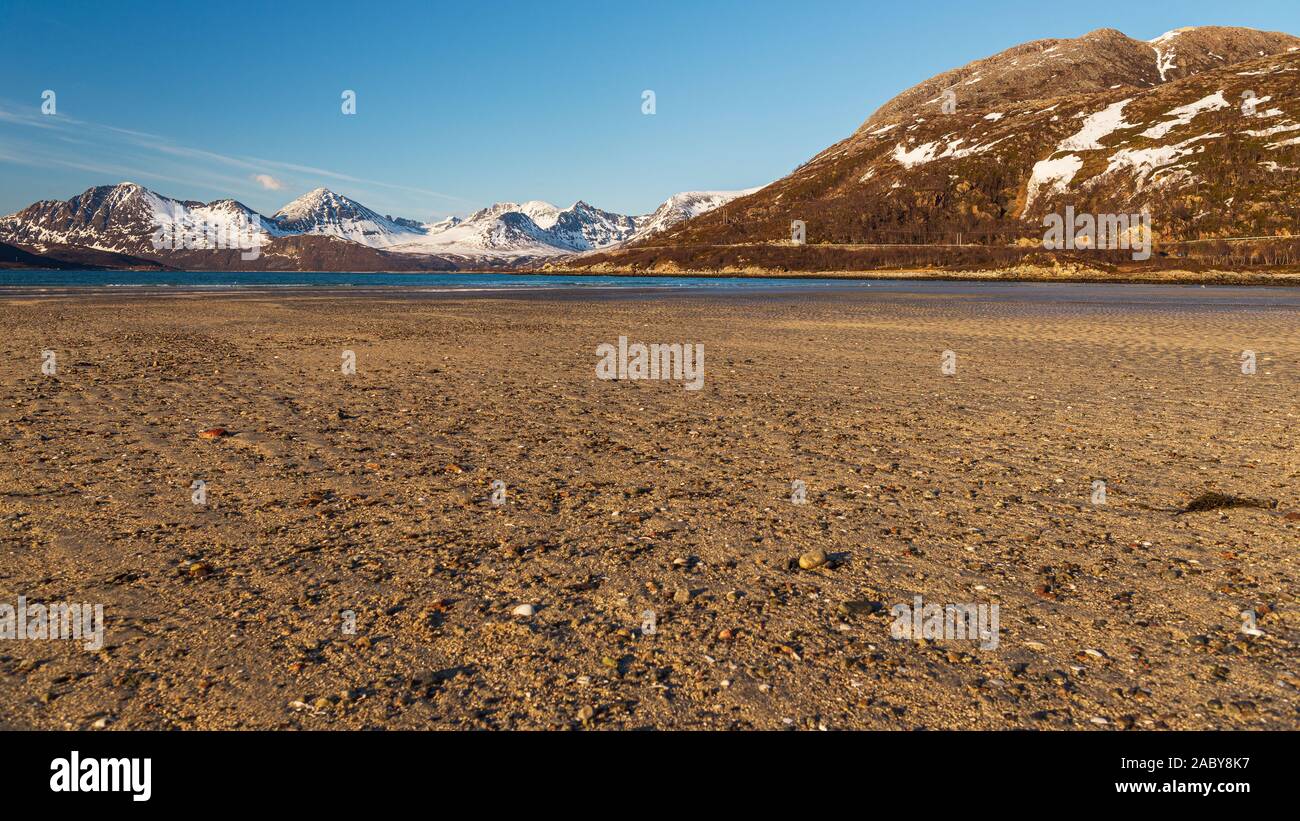 sunset over sandvika beach in Tromso region during a spring afternoon ...