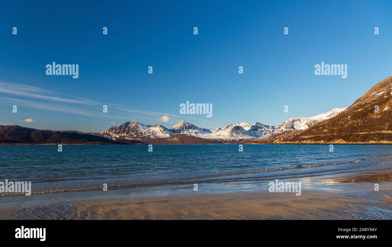 sunset over sandvika beach in Tromso region during a spring afternoon ...