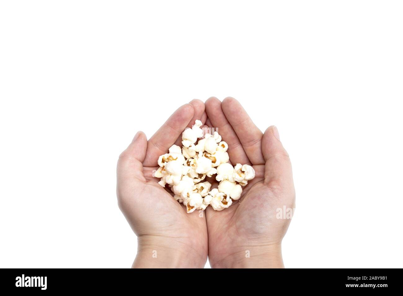 Hand holding popcorn isolated on the white background, space for text ...