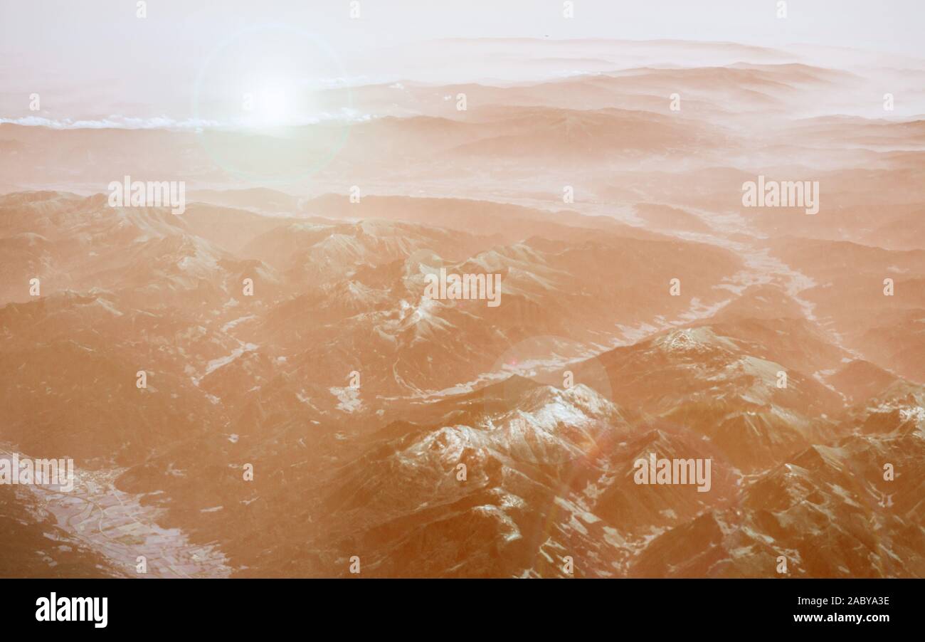 View from the plane to the Alps. Breathtaking view of sunrise and ...