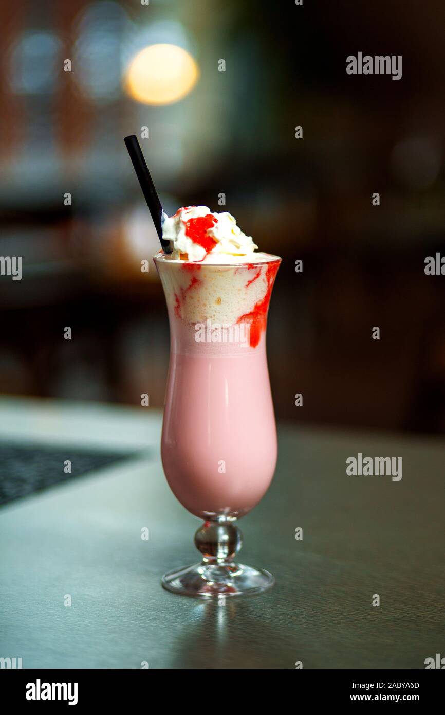 strawberry milkshake with whipped cream and strawberry syrup Stock ...