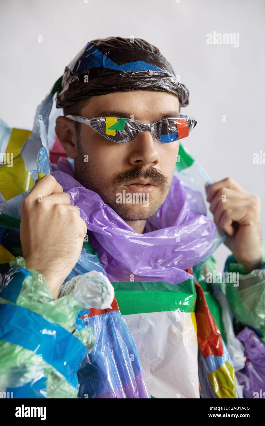 Close up of man wearing plastic on white background. Male model in ...