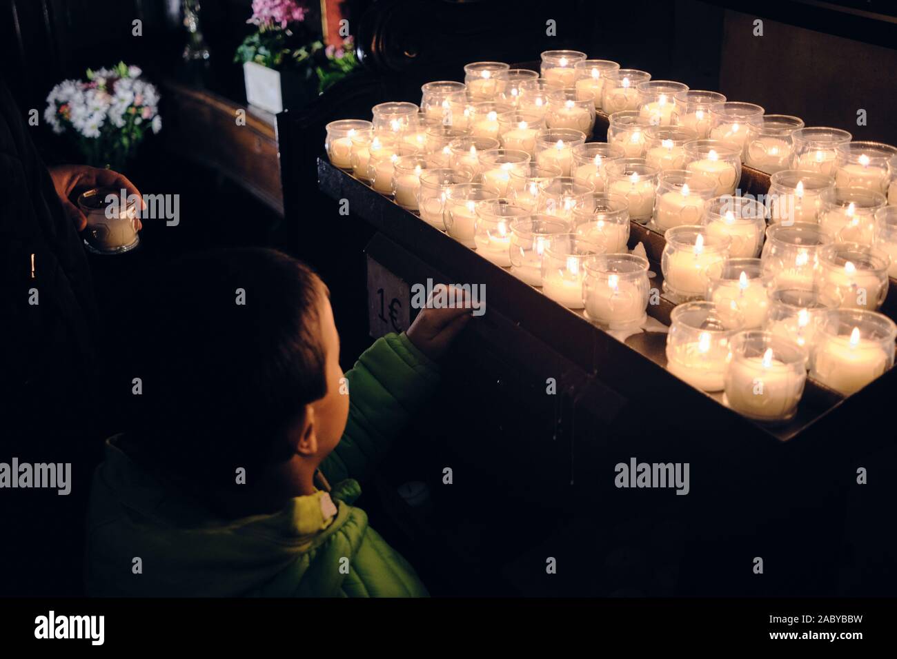 candles lighting church and children offering coin Stock Photo - Alamy