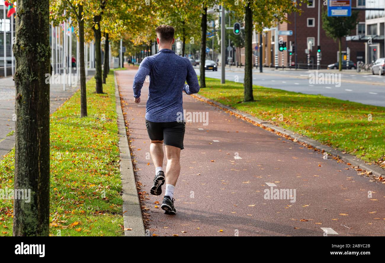 Man running back view one hi-res stock photography and images - Alamy