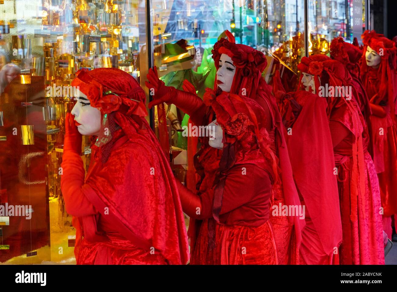 The Extinction Rebellion Red Brigade protesting on Black Friday on ...