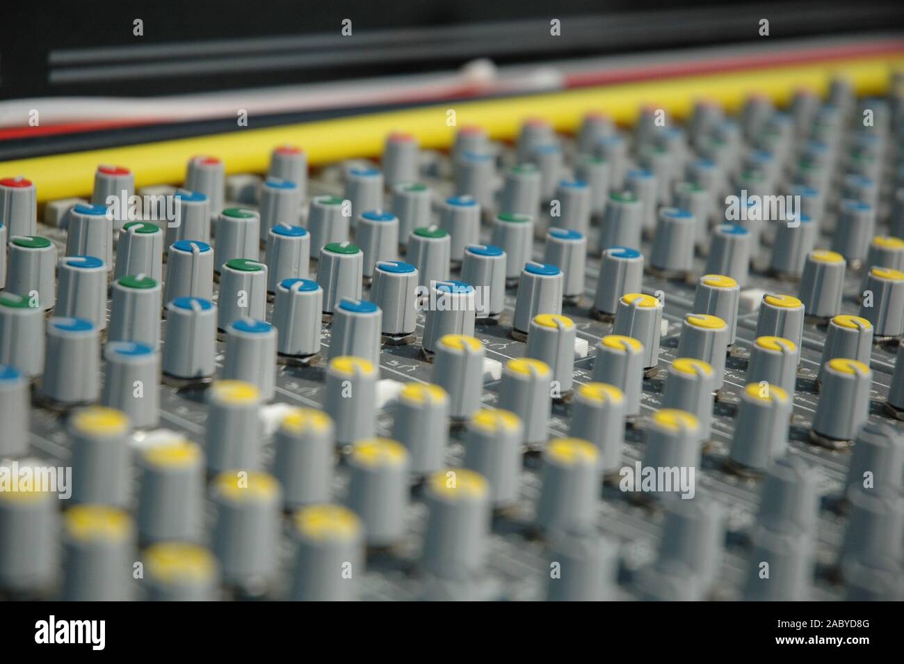 Audio mixing console in a recording studio. Faders and knobs of a sound ...