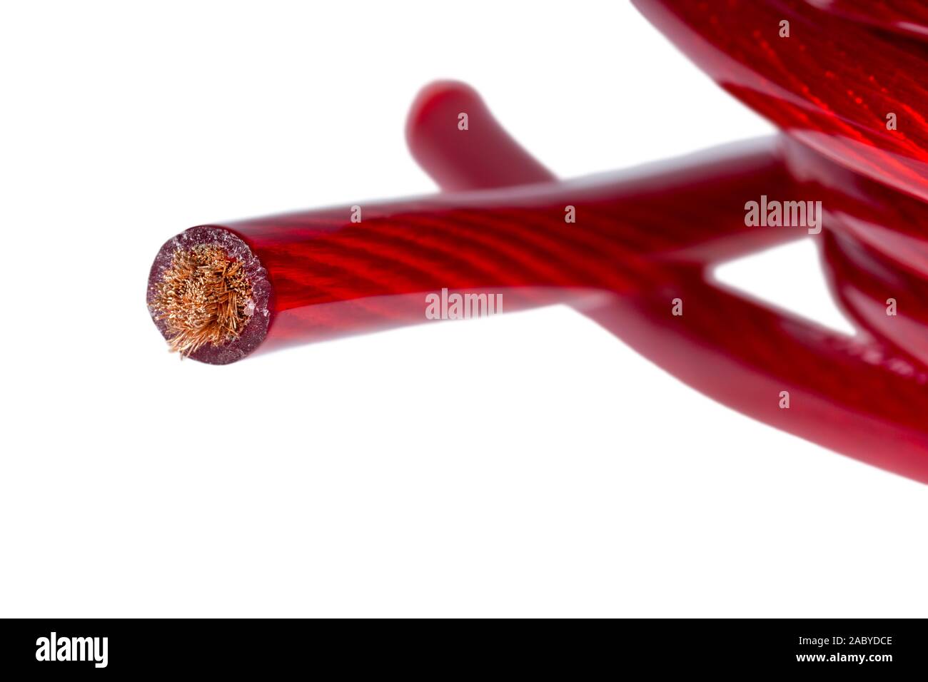 Red power cable isolated on white background Stock Photo - Alamy