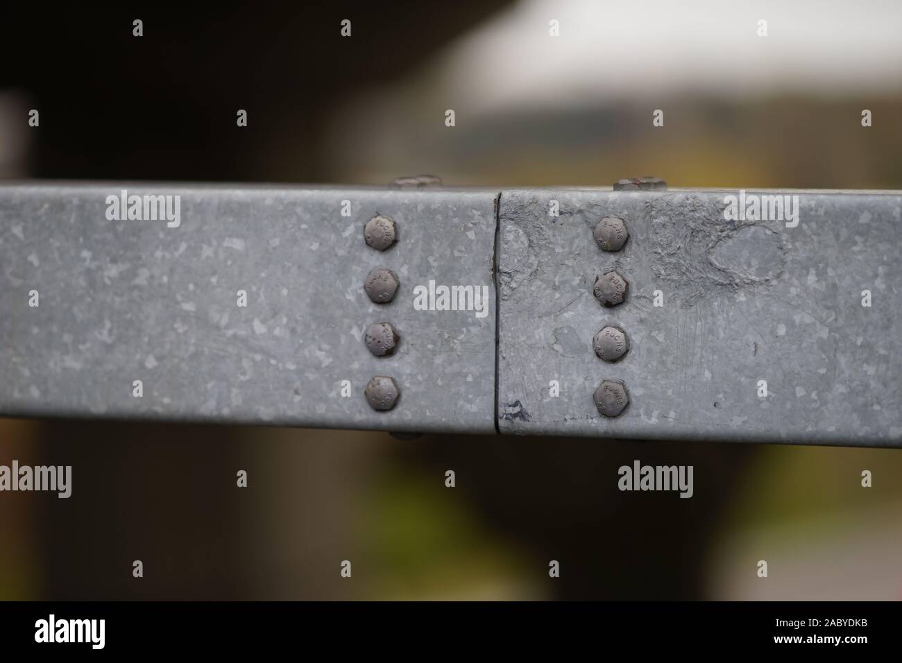 Closeup bolt caps on steel structure Stock Photo - Alamy