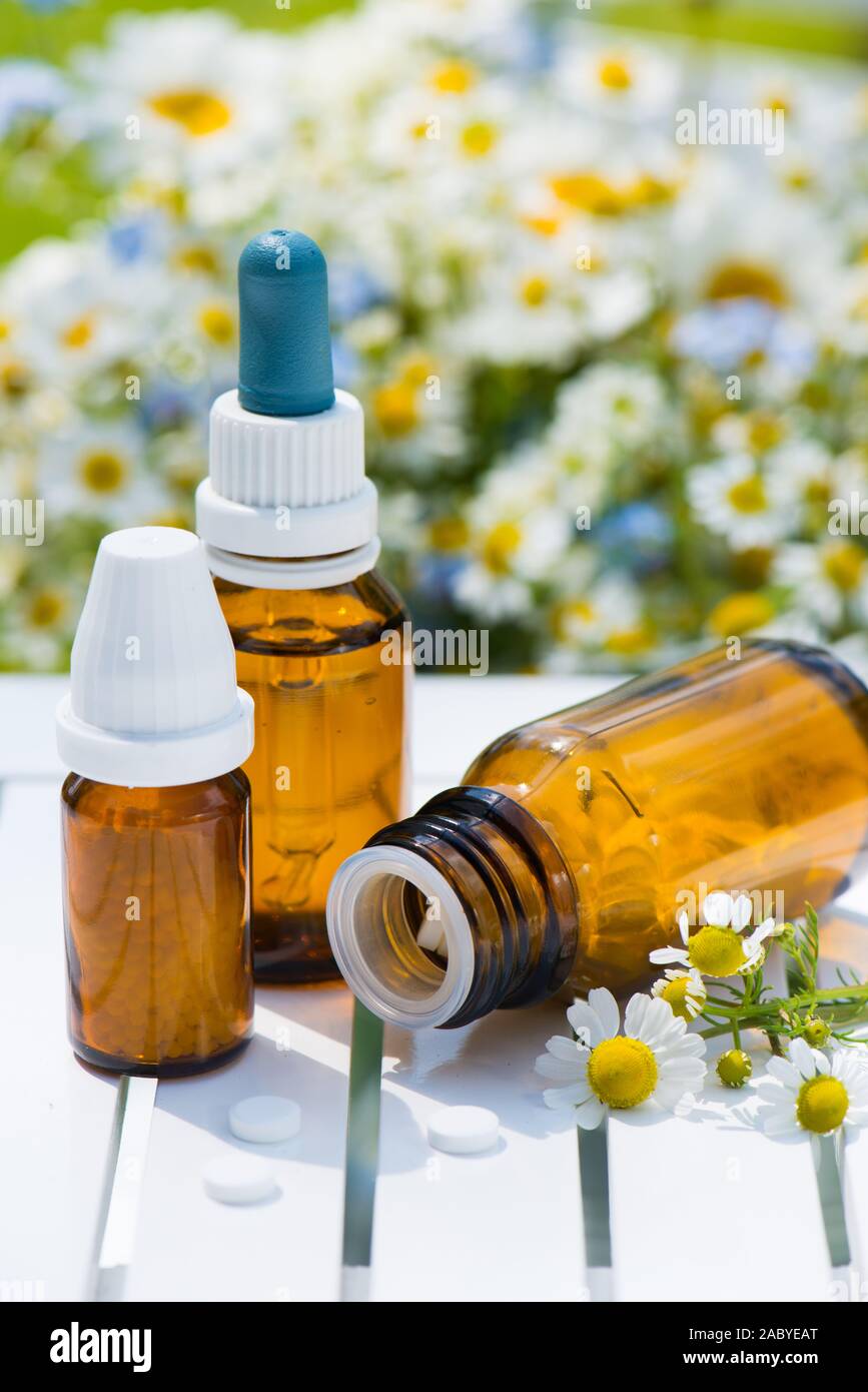 homeopathy medicine with chamomile flowers Stock Photo - Alamy