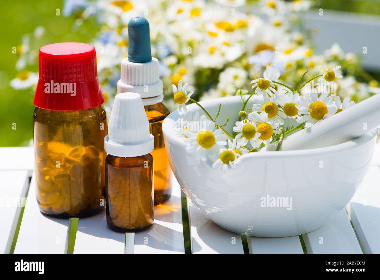 homeopathy medicine with chamomile flowers Stock Photo - Alamy