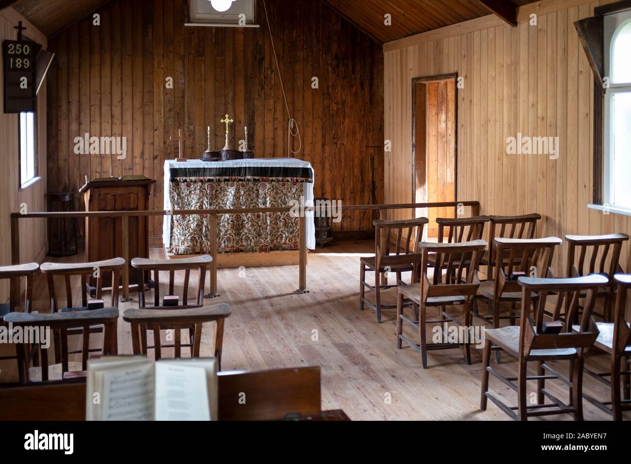 Interior of a modest wooden church at the Weald and Downland Museum ...