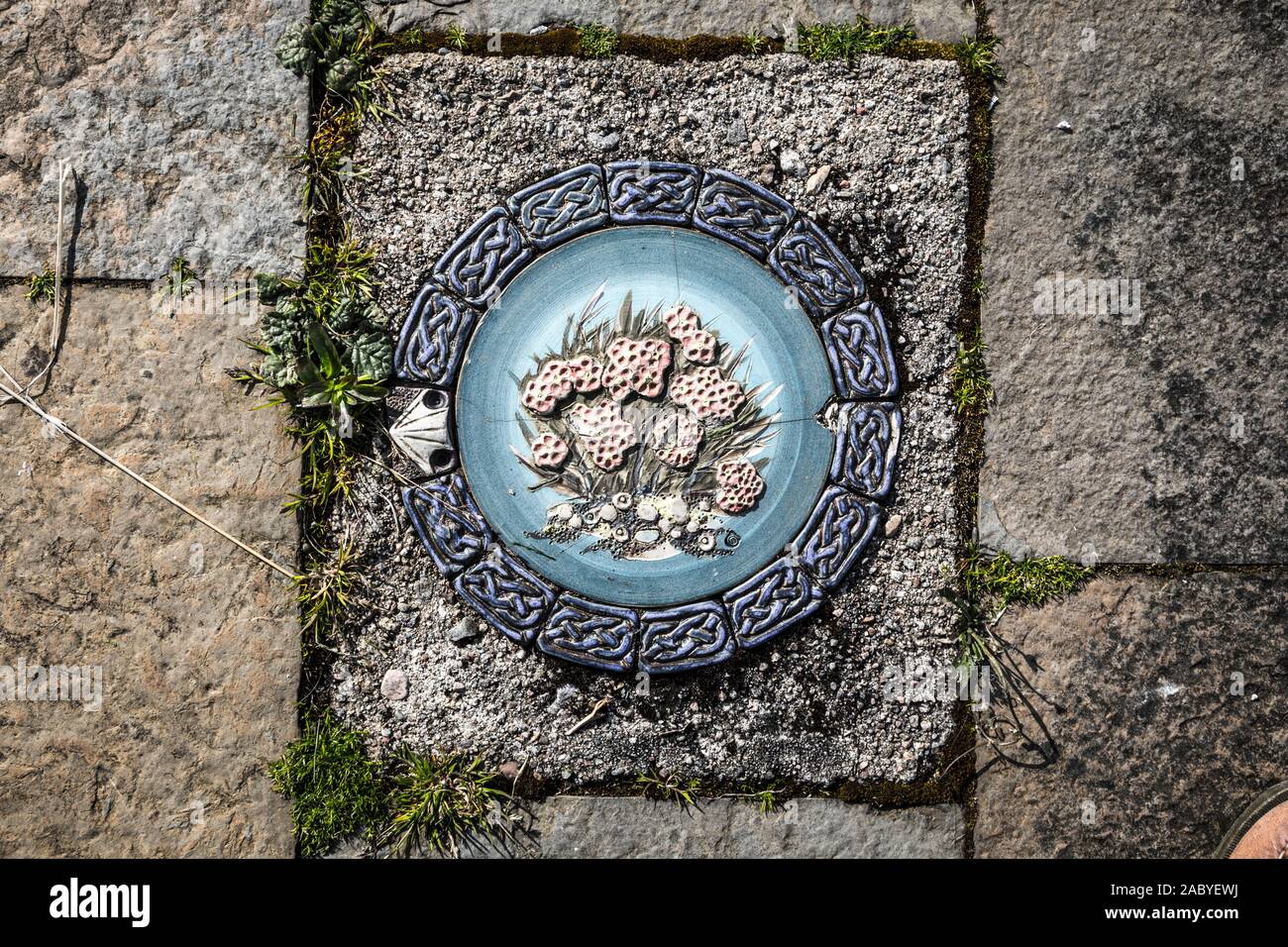 Decorative marker inset into the footpath at Kyleakin, Isle of Skye ...
