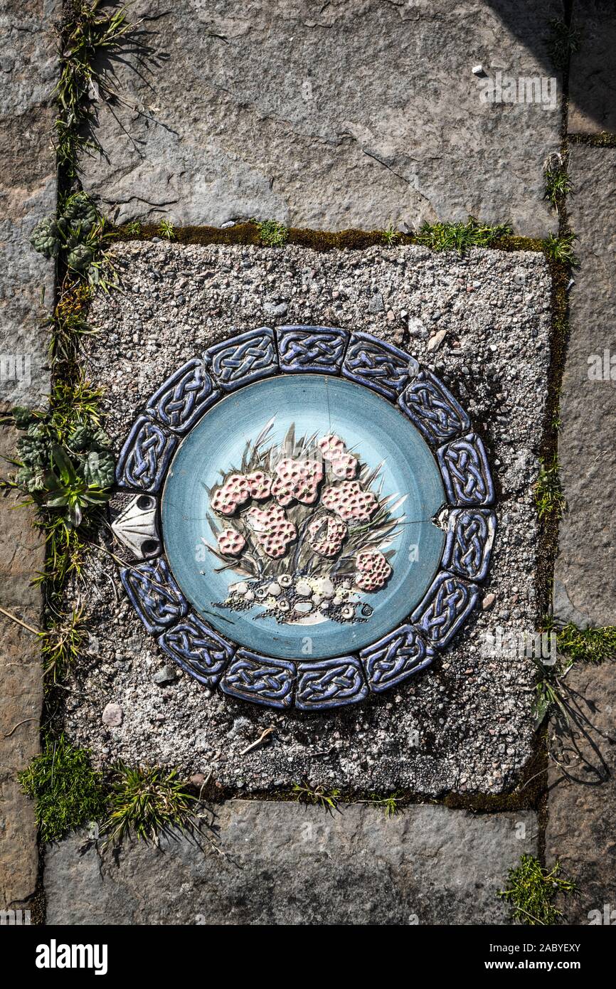 Decorative marker inset into the footpath at Kyleakin, Isle of Skye ...