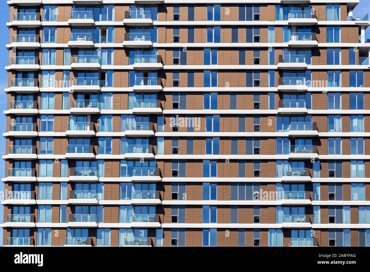 Modern apartment building with repeating balconies and windows Stock ...