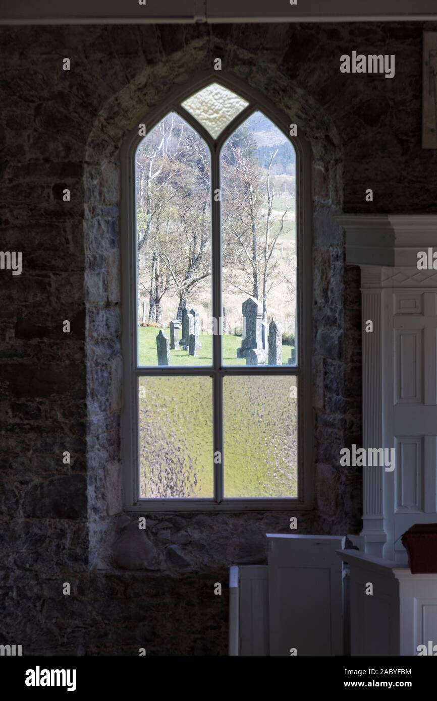 View of the graveyard through a window of Clachan church Applecross ...