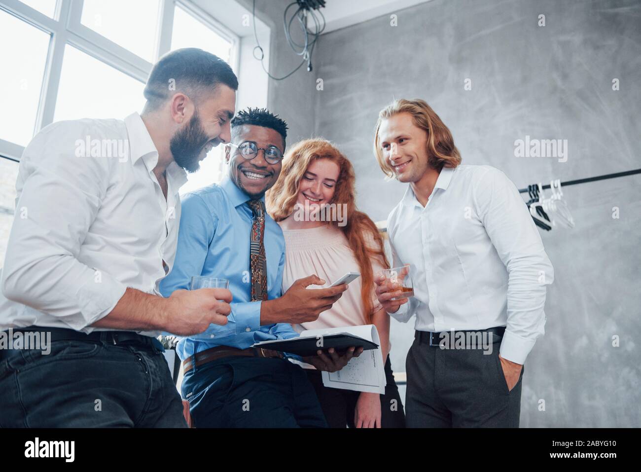 Sincere smiles. Beautiful business people love their job and shairs ...