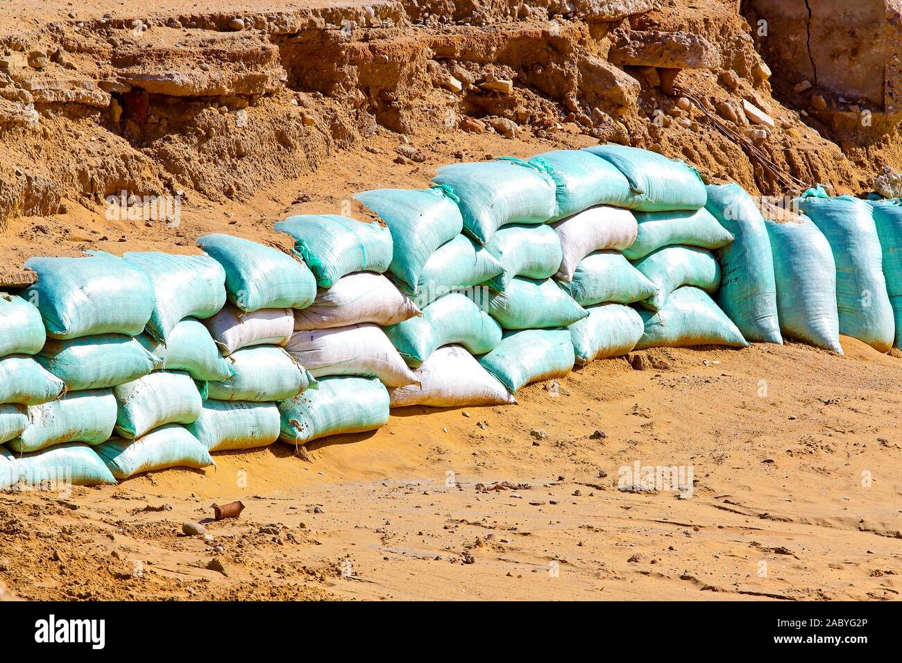 Sand bags barrier for water flood protection Stock Photo - Alamy
