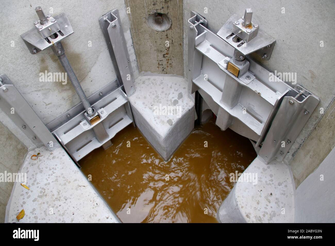View from above into a sewer manhole Stock Photo - Alamy