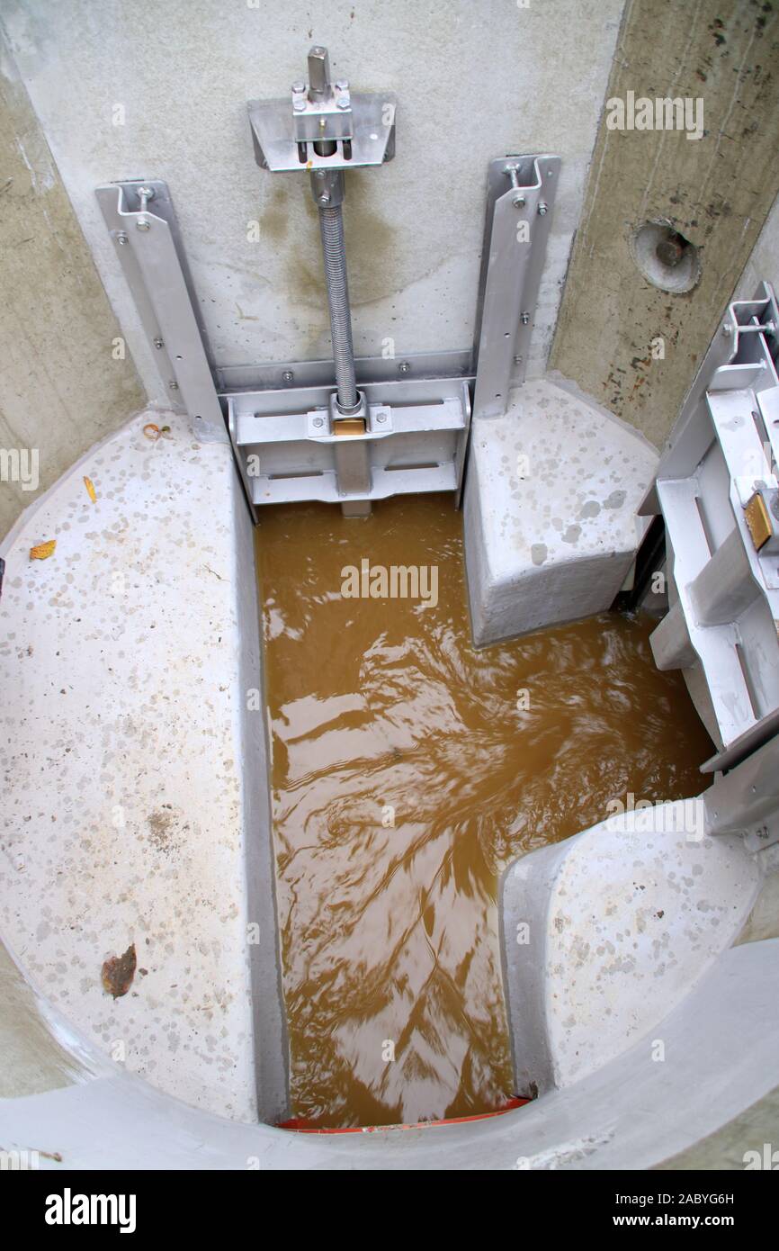 View from above into a sewer manhole Stock Photo - Alamy