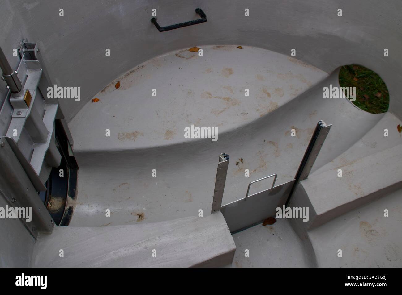 View from above into a sewer manhole Stock Photo - Alamy