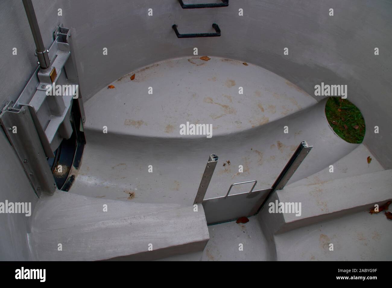 View from above into a sewer manhole Stock Photo - Alamy