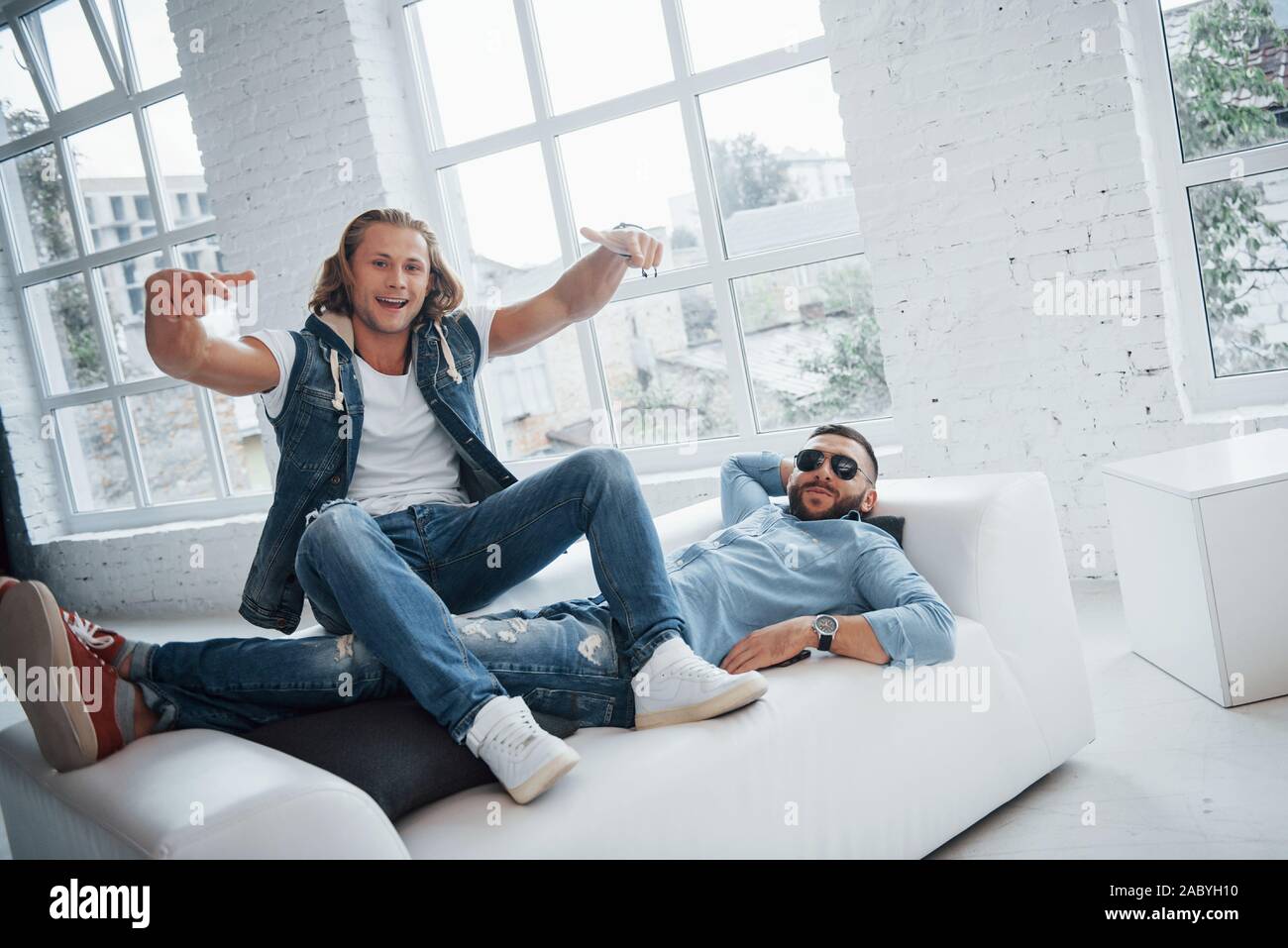 Two comrades posing and going mad after the end of a work day Stock ...