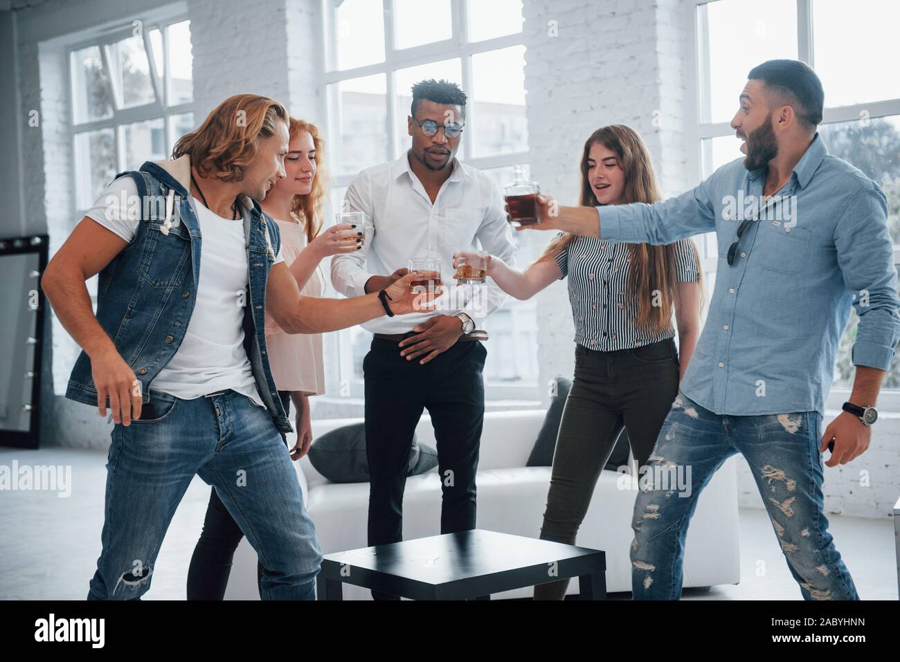 Brave man decides to drink more today. Young people having good time in ...