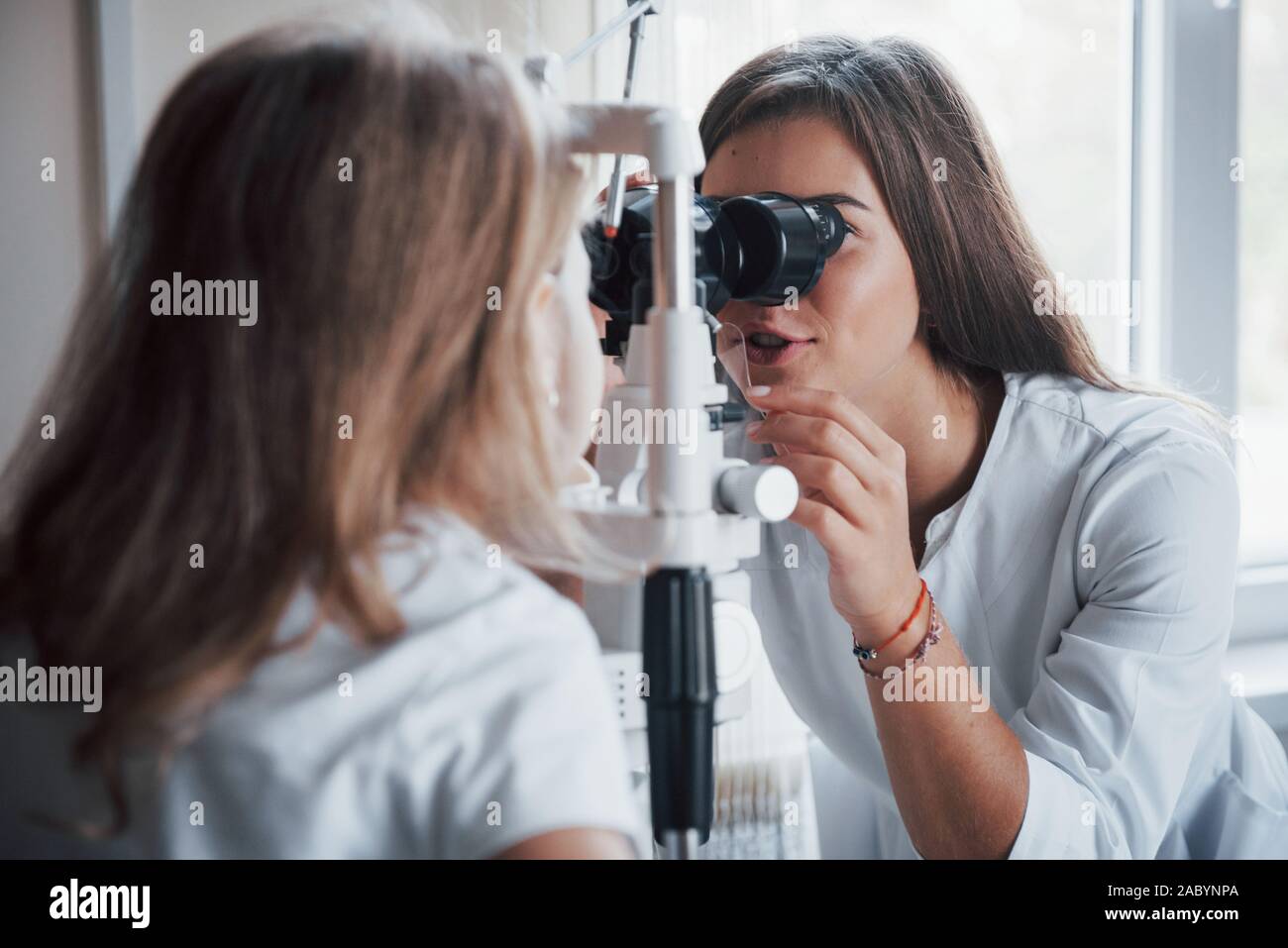 Process of diagnosing eye dysfunctions by female oculist with special ...