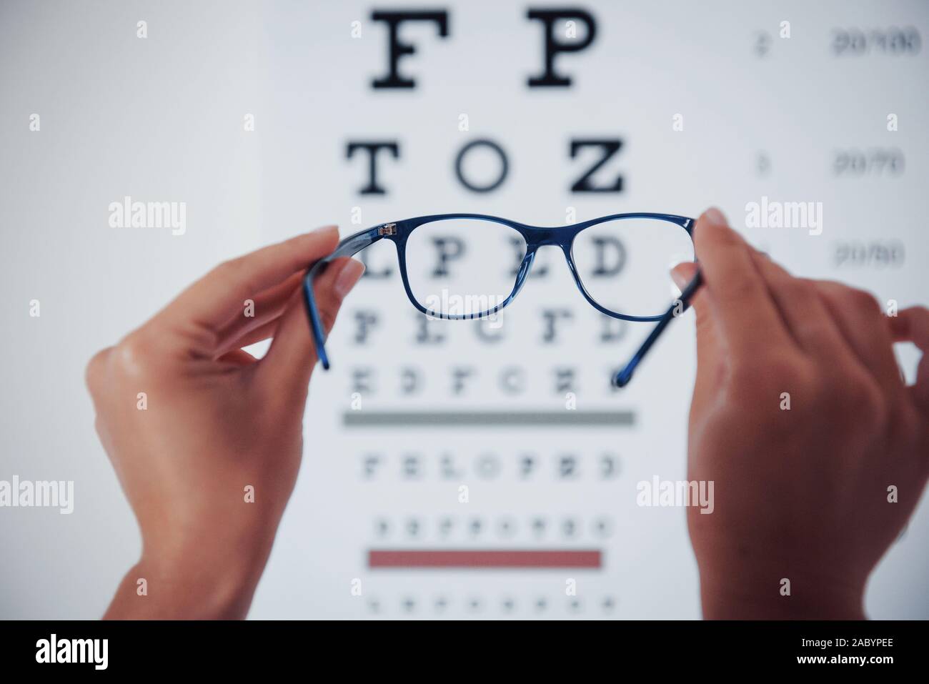 Beautiful focus on eyewear. Woman hands holding the glasses on ...