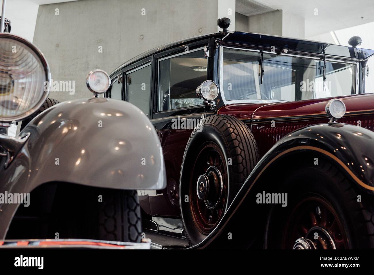 Close up side view of a red retro car with chrome spotlight, narrow ...