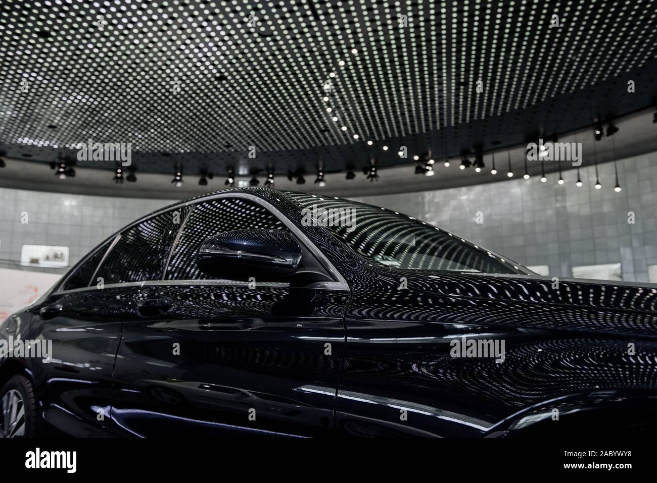 Side view of modern deep blue sport car with right mirror, titanium ...