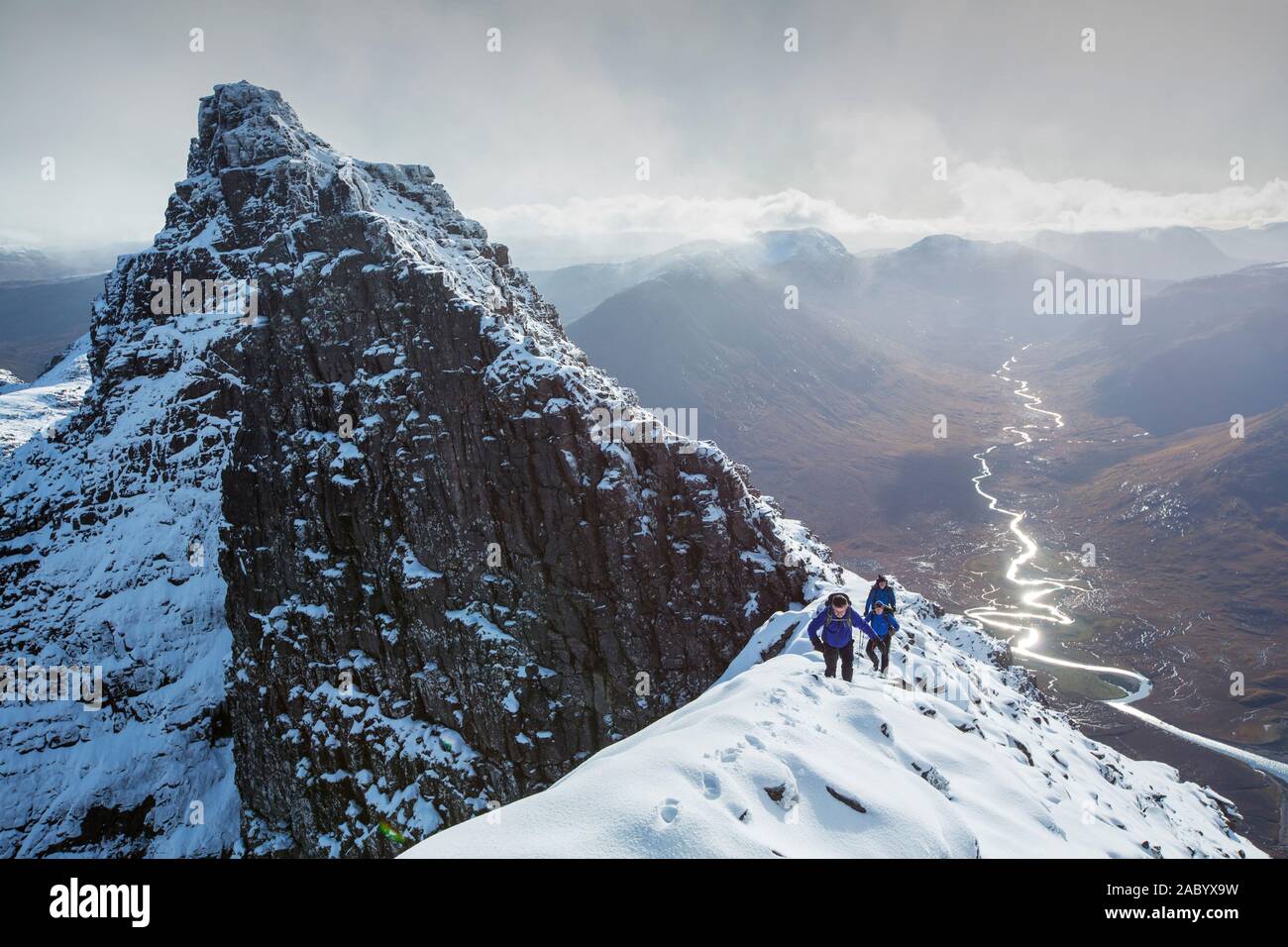 Mountaineers below Lord Berkeley's Seat on the Munro An Teallach, one ...