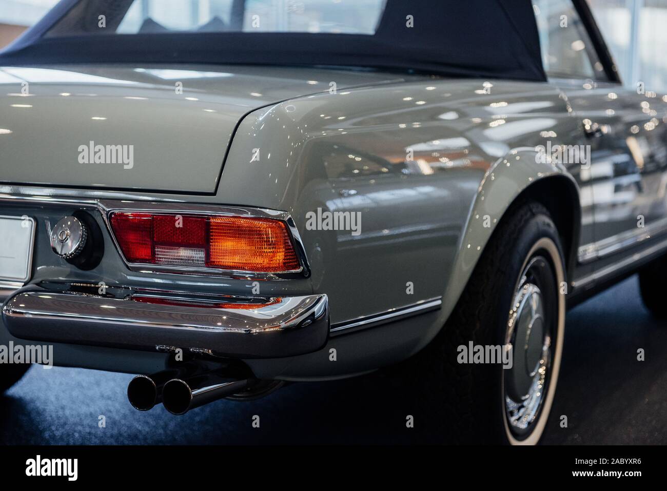 Back and side view of grey retro cabriolet car with close up of right ...