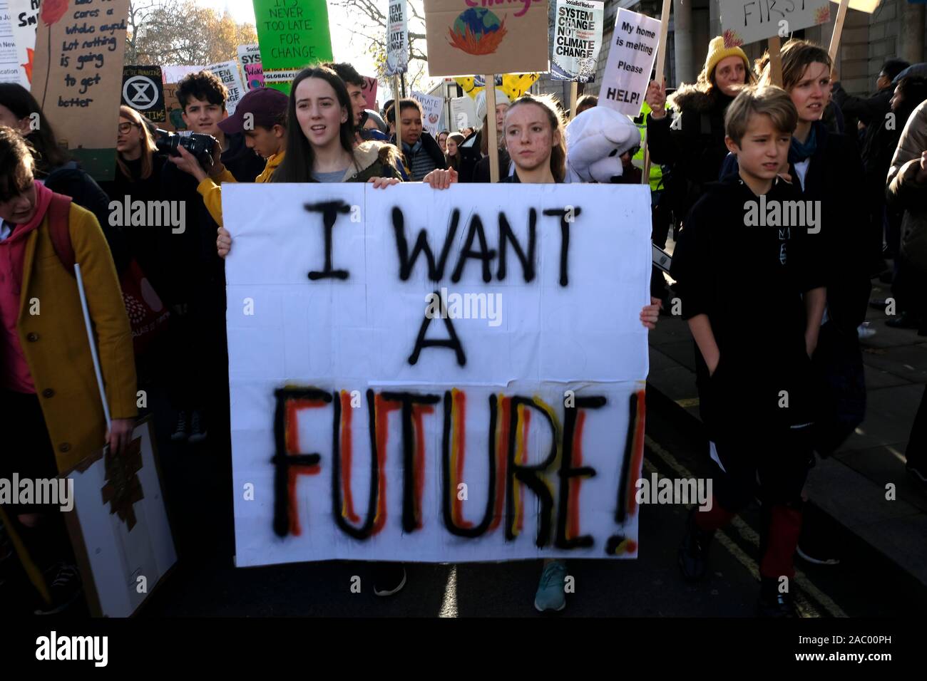 Environmental protesters holding a banner and placards during the ...