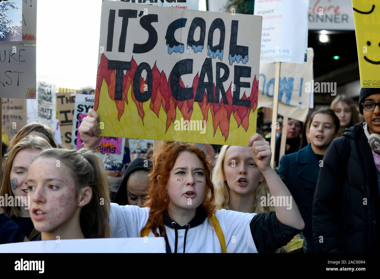 Environmental protester holding a placard during the strike.Children ...