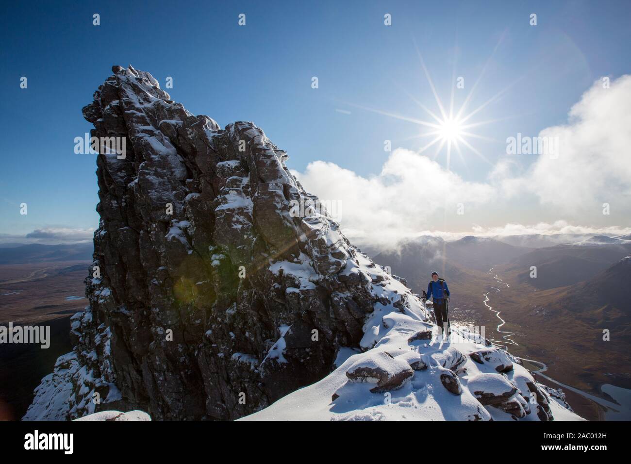 Mountaineer below Lord Berkeley's Seat on the Munro An Teallach, one of ...