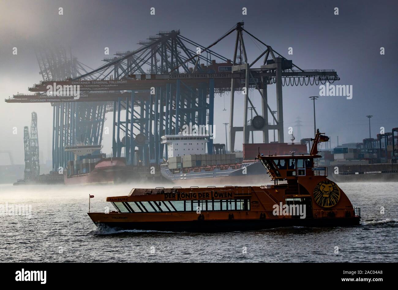 Container Terminal Tollerort in the Port of Hamburg, fog, container ship being loaded and ...