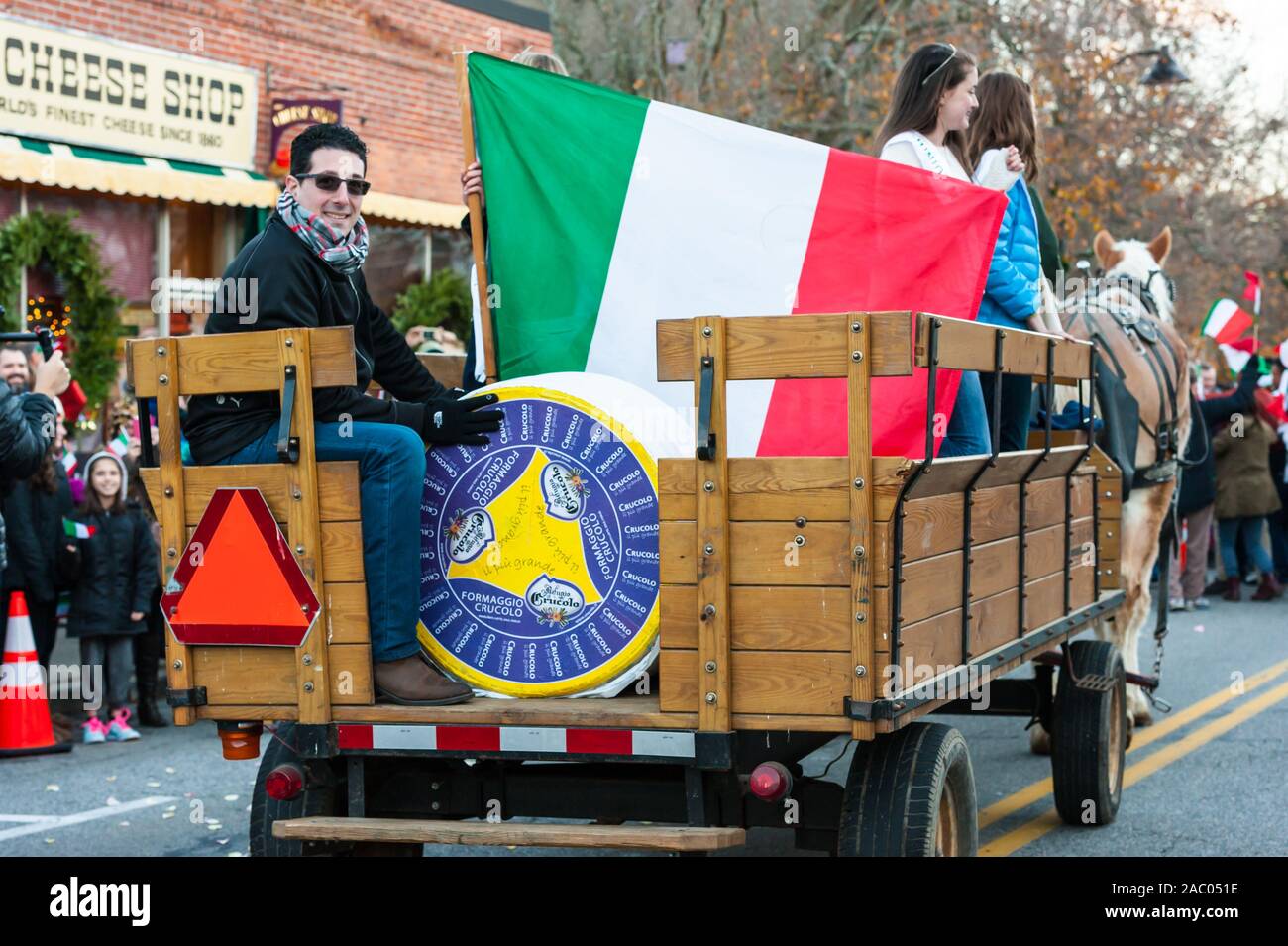 A horse drawn carriage carrying the 400lb wheel of Crucolo cheese to ...