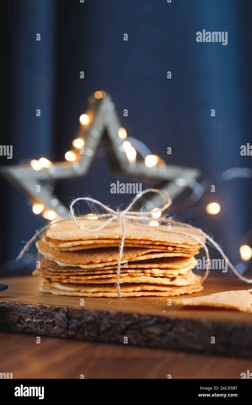 Stack of Norwegian crispy round waffles Krumkake on a tray. Concept of ...