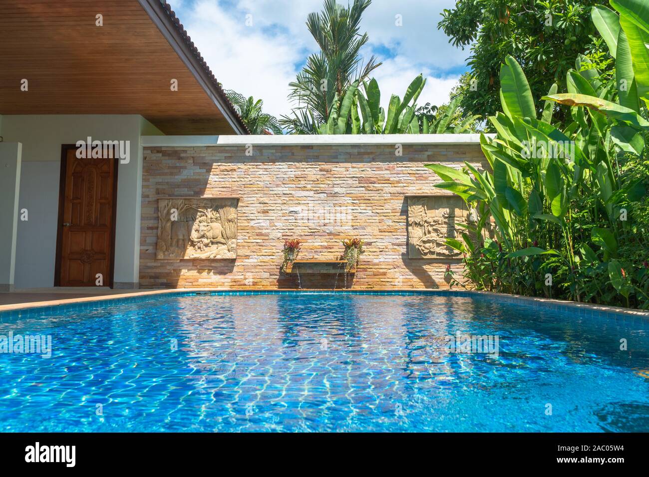 blue water in swimming pool beside the house Stock Photo - Alamy