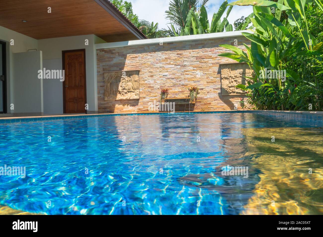 blue water in swimming pool beside the house Stock Photo - Alamy