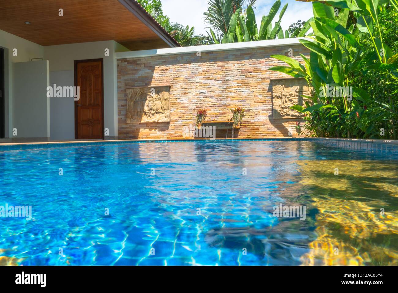 blue water in swimming pool beside the house Stock Photo - Alamy