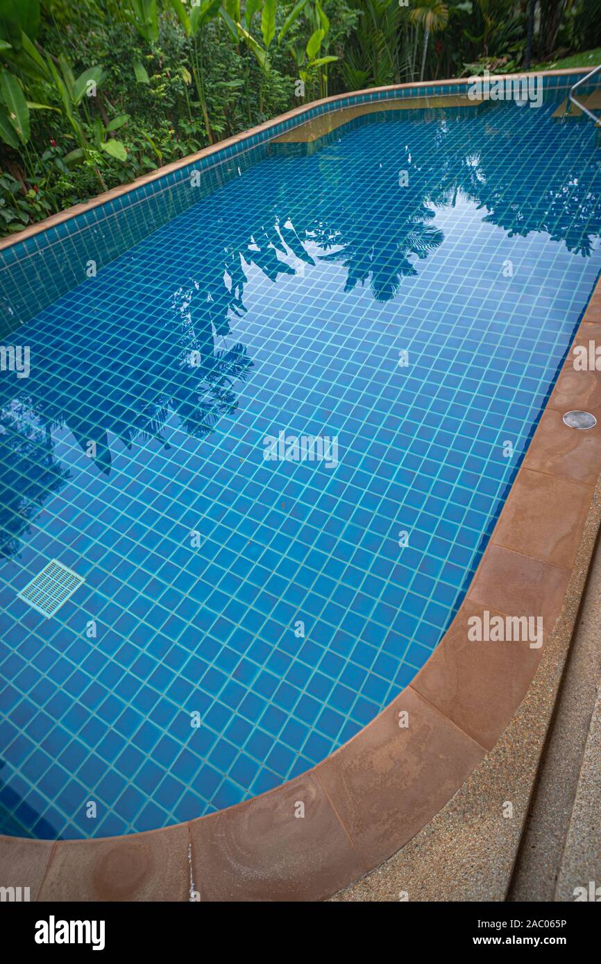 blue water in swimming pool beside the house Stock Photo - Alamy