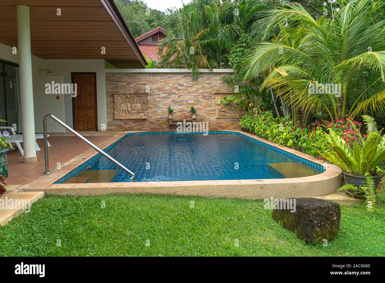 blue water in swimming pool beside the house Stock Photo - Alamy