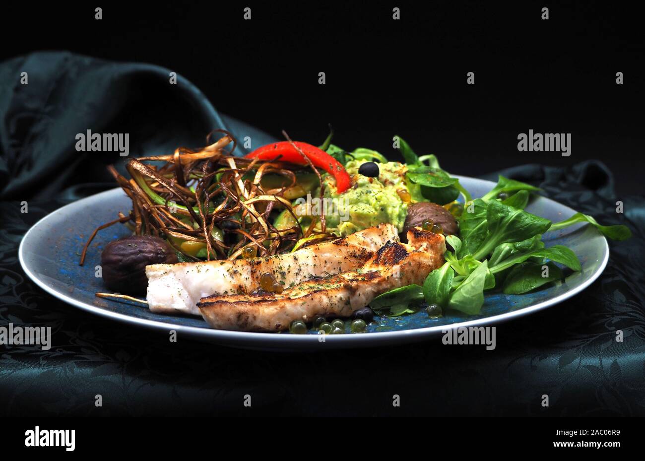 crocodile steak with garnish as decoration Stock Photo - Alamy