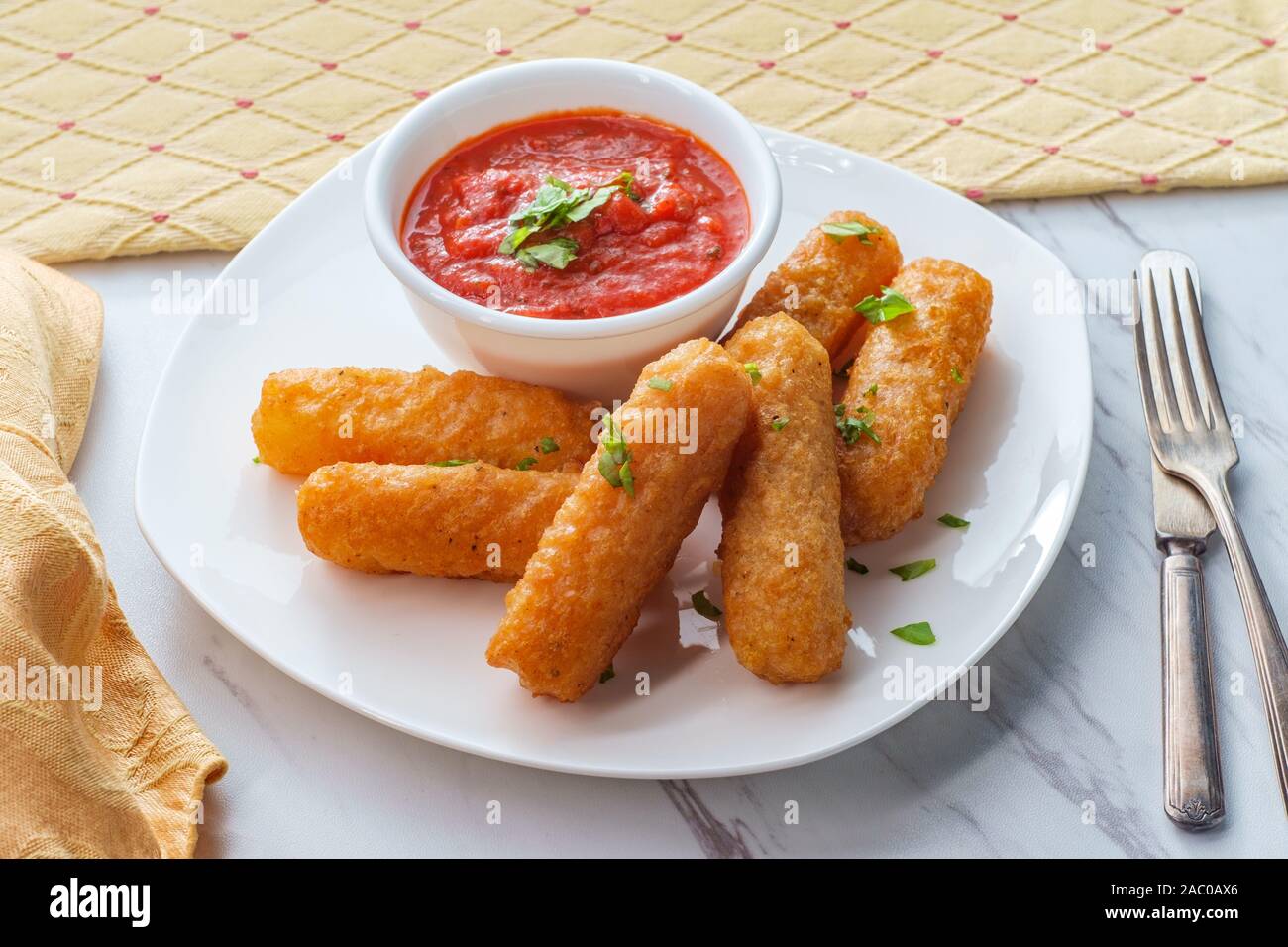 Breaded fried mozzarella cheese sticks with tomato marinara dipping ...