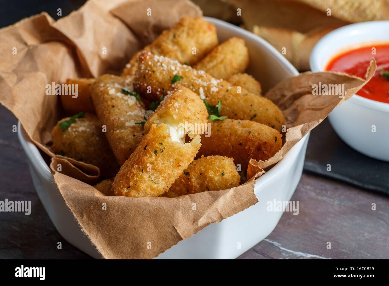 Breaded fried mozzarella cheese sticks with tomato marinara dipping ...